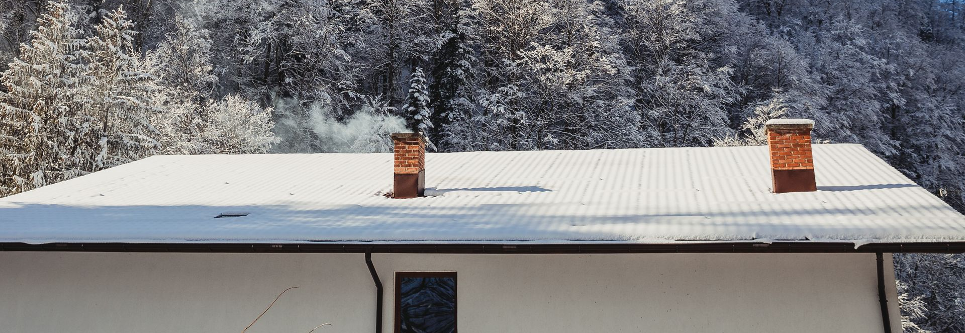 Snow Load on Flat Roofs & How to Prevent Roof Collapse & Damage