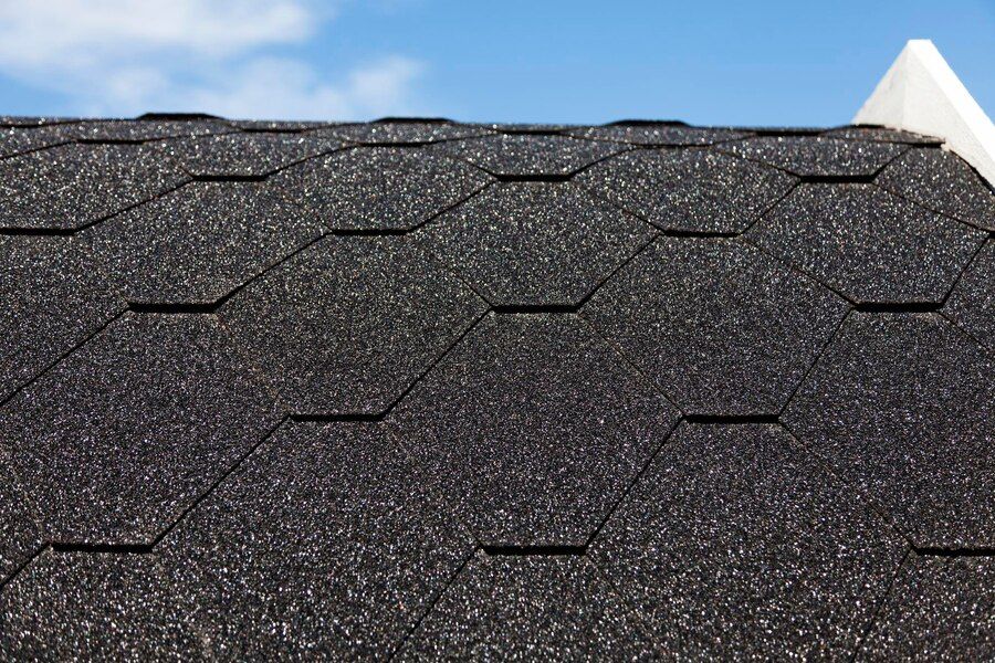 Roofing Material Comparison: Rolled Roofing vs. Asphalt Shingles