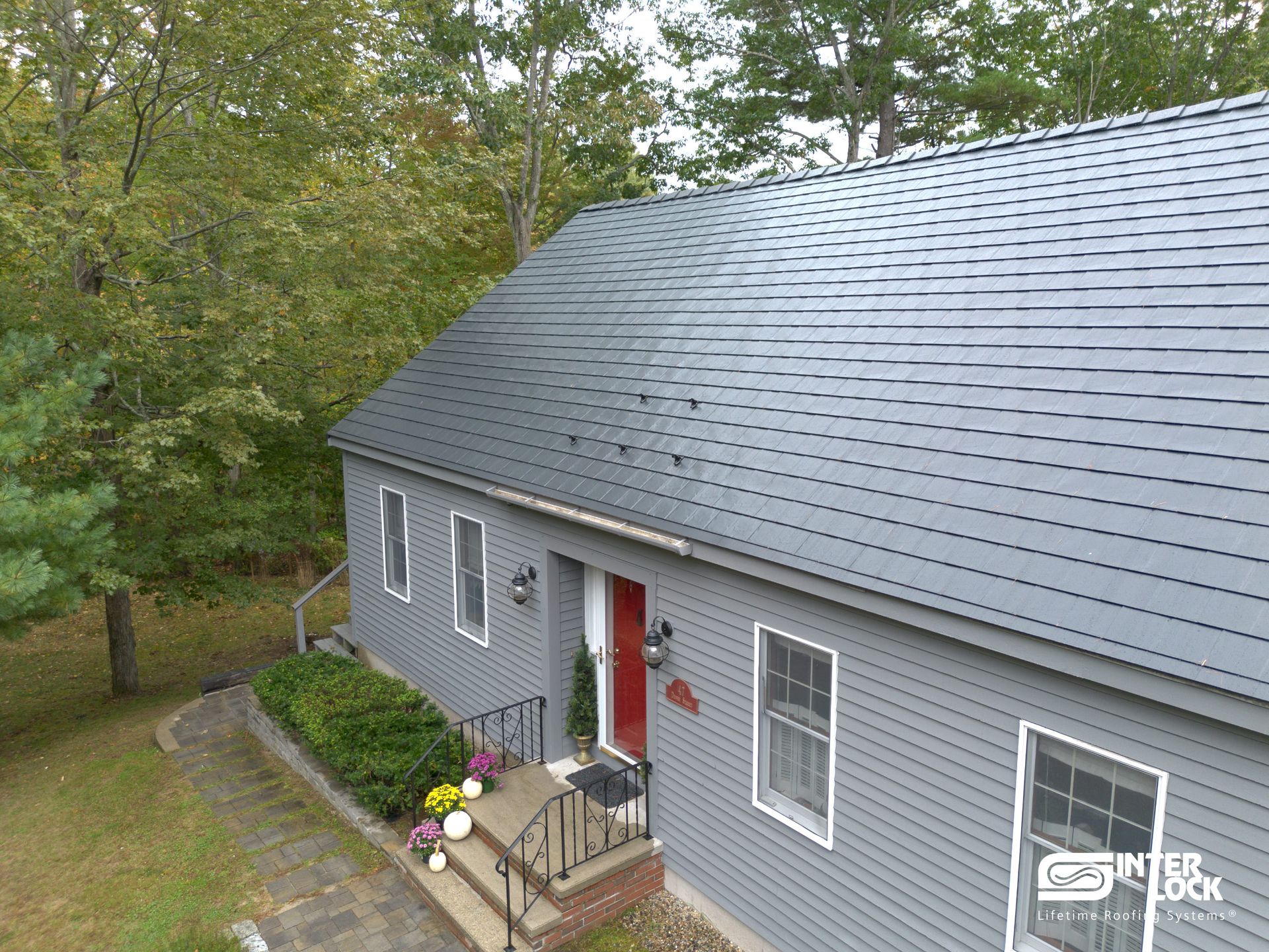 Black Interlock Metal Slate Roofing System Installed on Rochester, NH Home