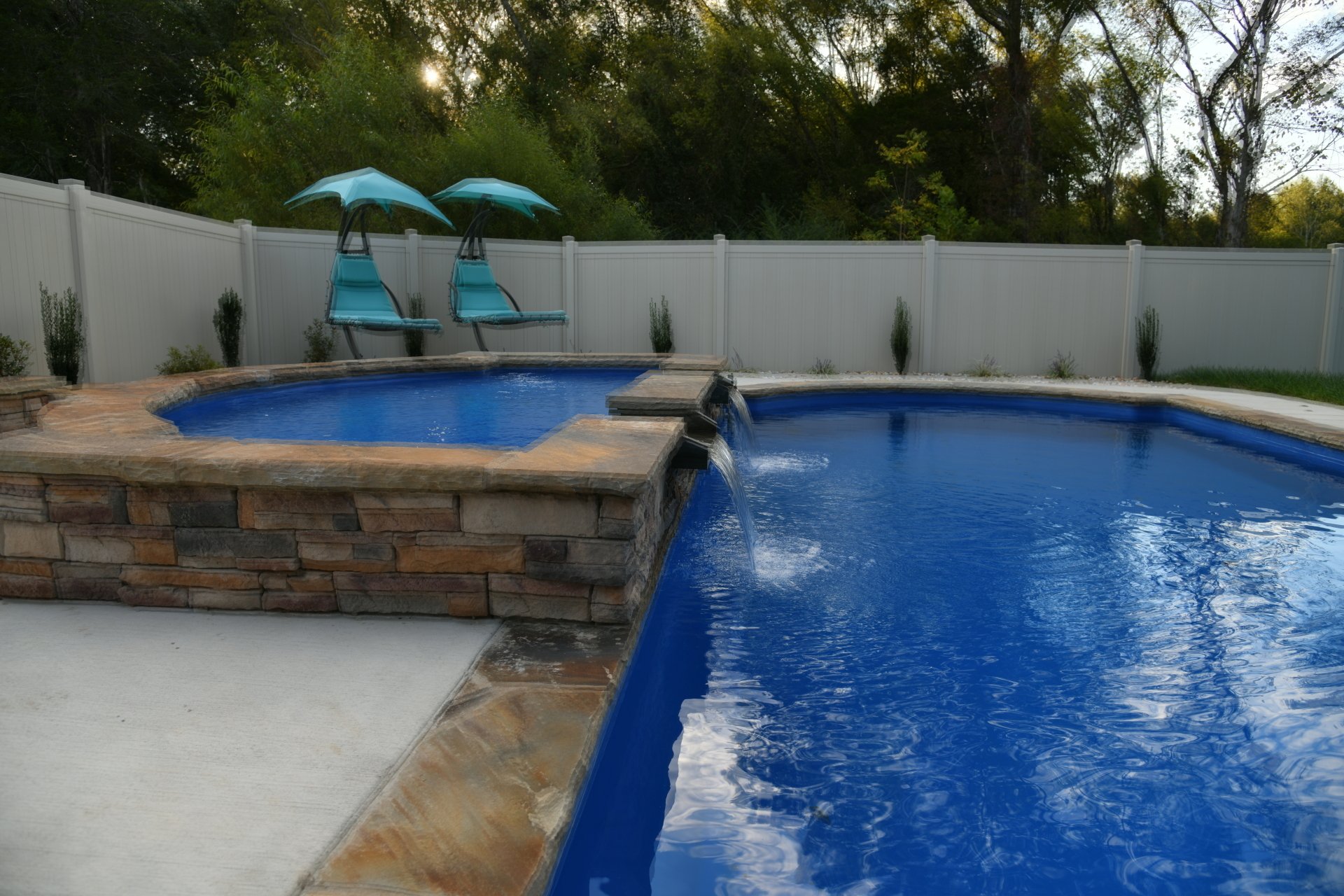 Cathedral Fiberglass Pool with Flagstone Coping, Wet Deck & Spillovers ...