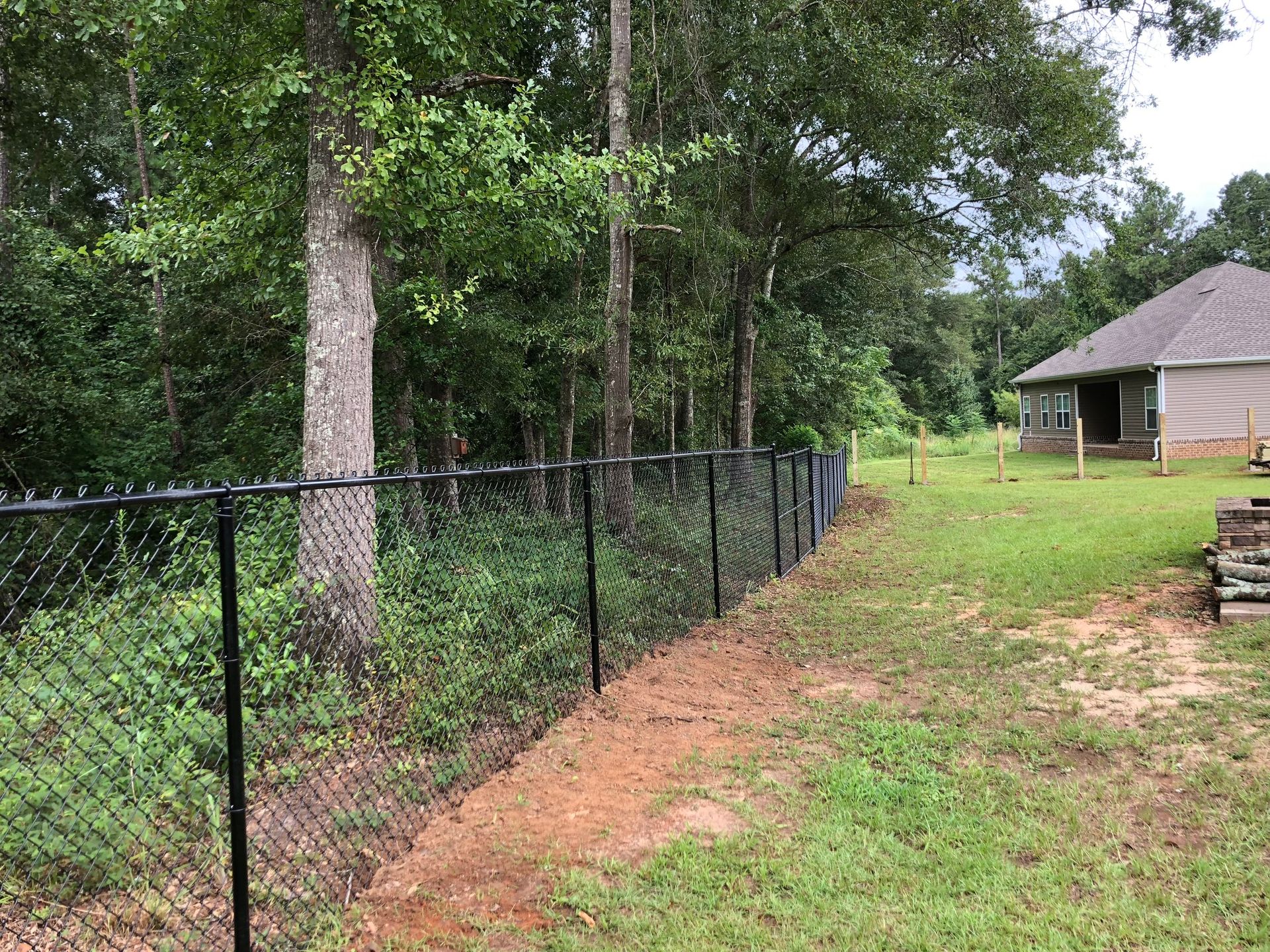 Galvanized/black chain link Installation | Byron Fence