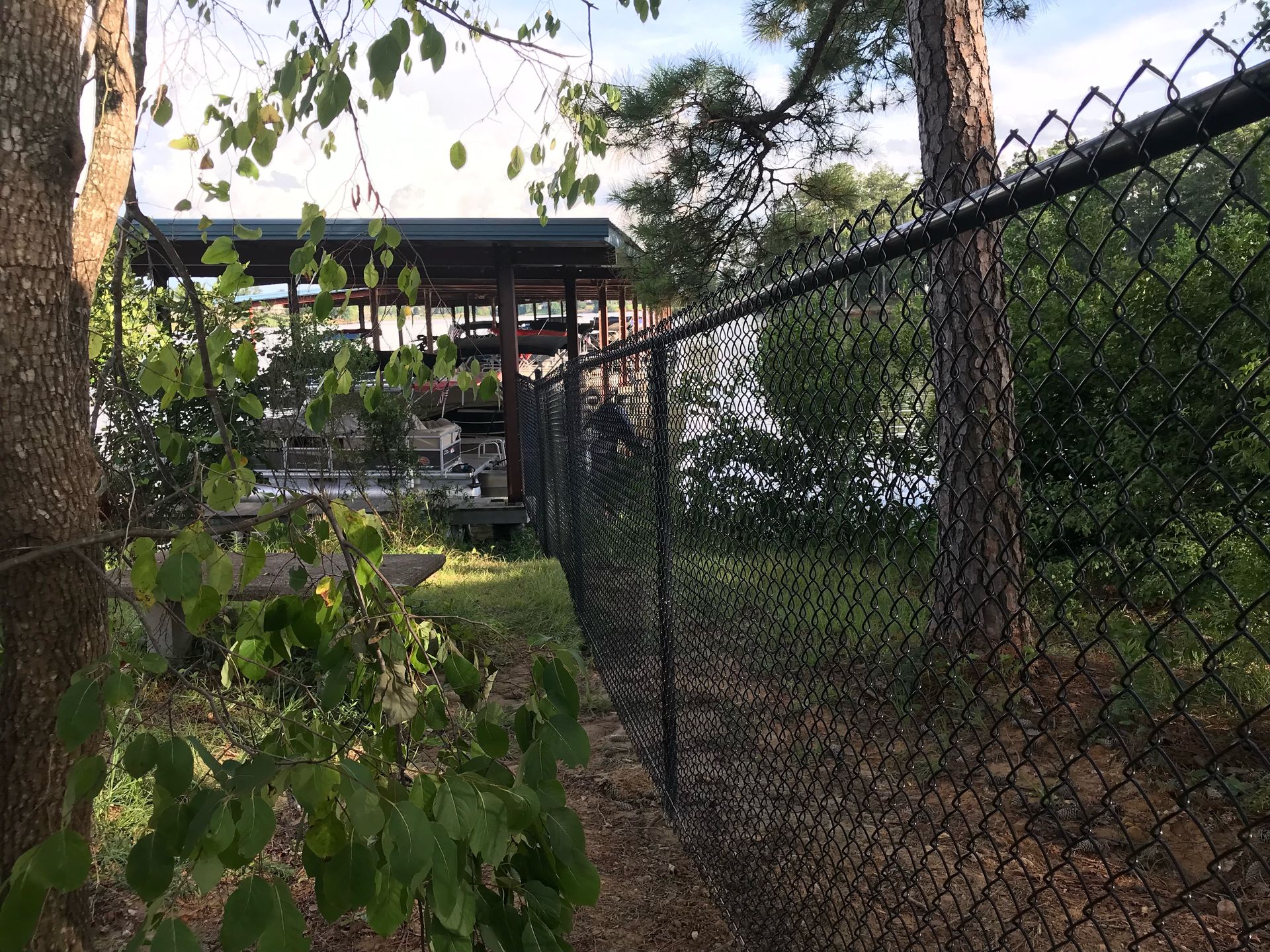 Galvanized/black chain link Installation | Byron Fence