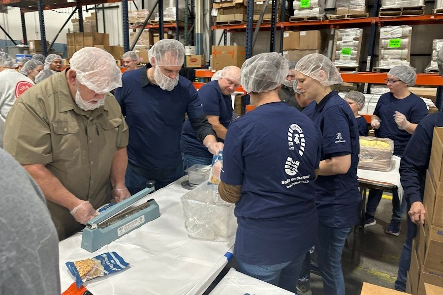 TAI Staff Volunteer at Feed My Starving Children MobilePack Event