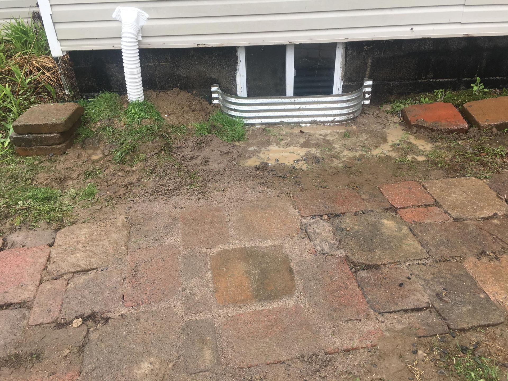 Window Well Installation | Wet Basement Aid