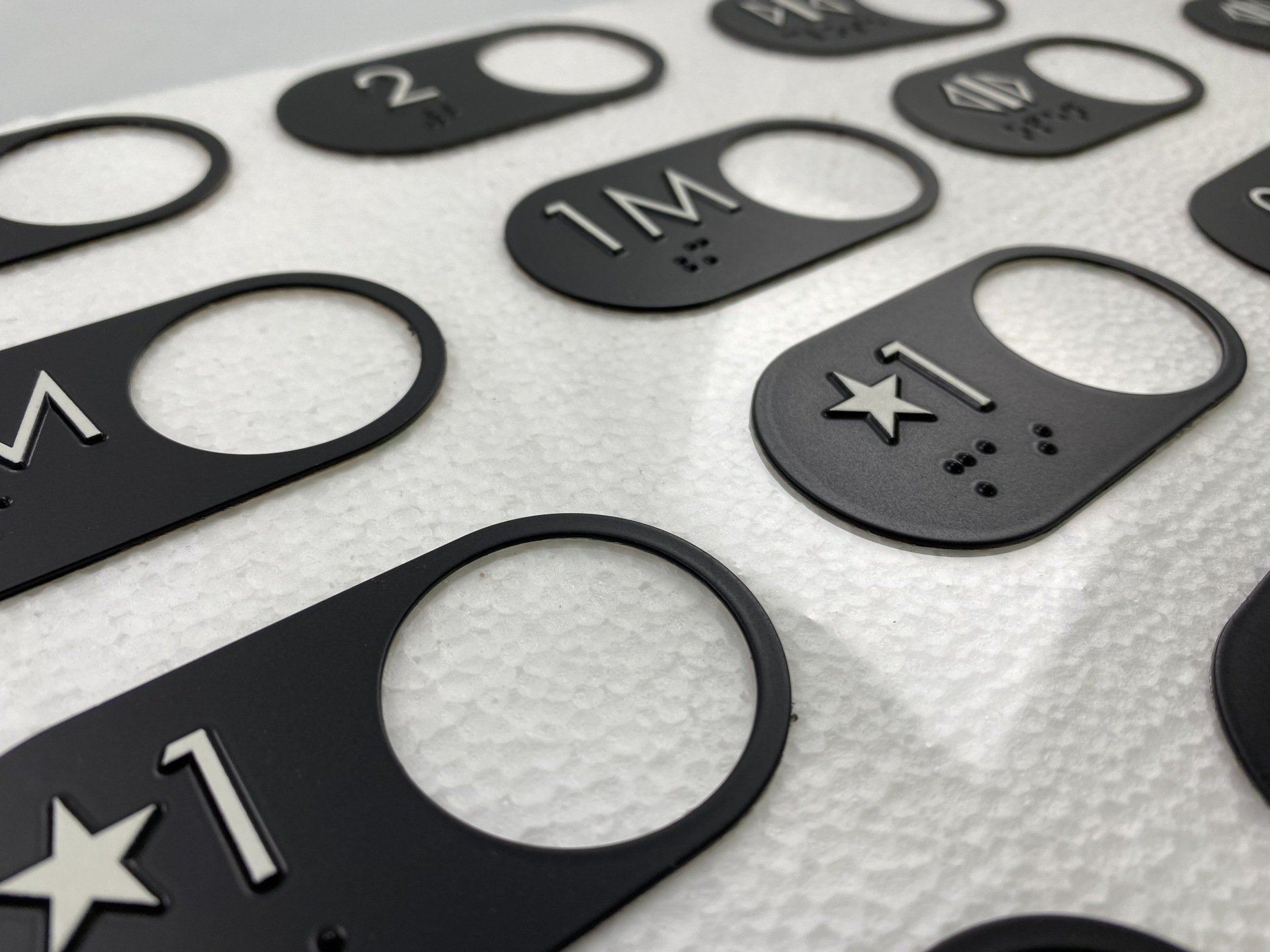 ELEVATOR BUTTON PLATES/SURROUNDS | VisionMark Nameplate Company